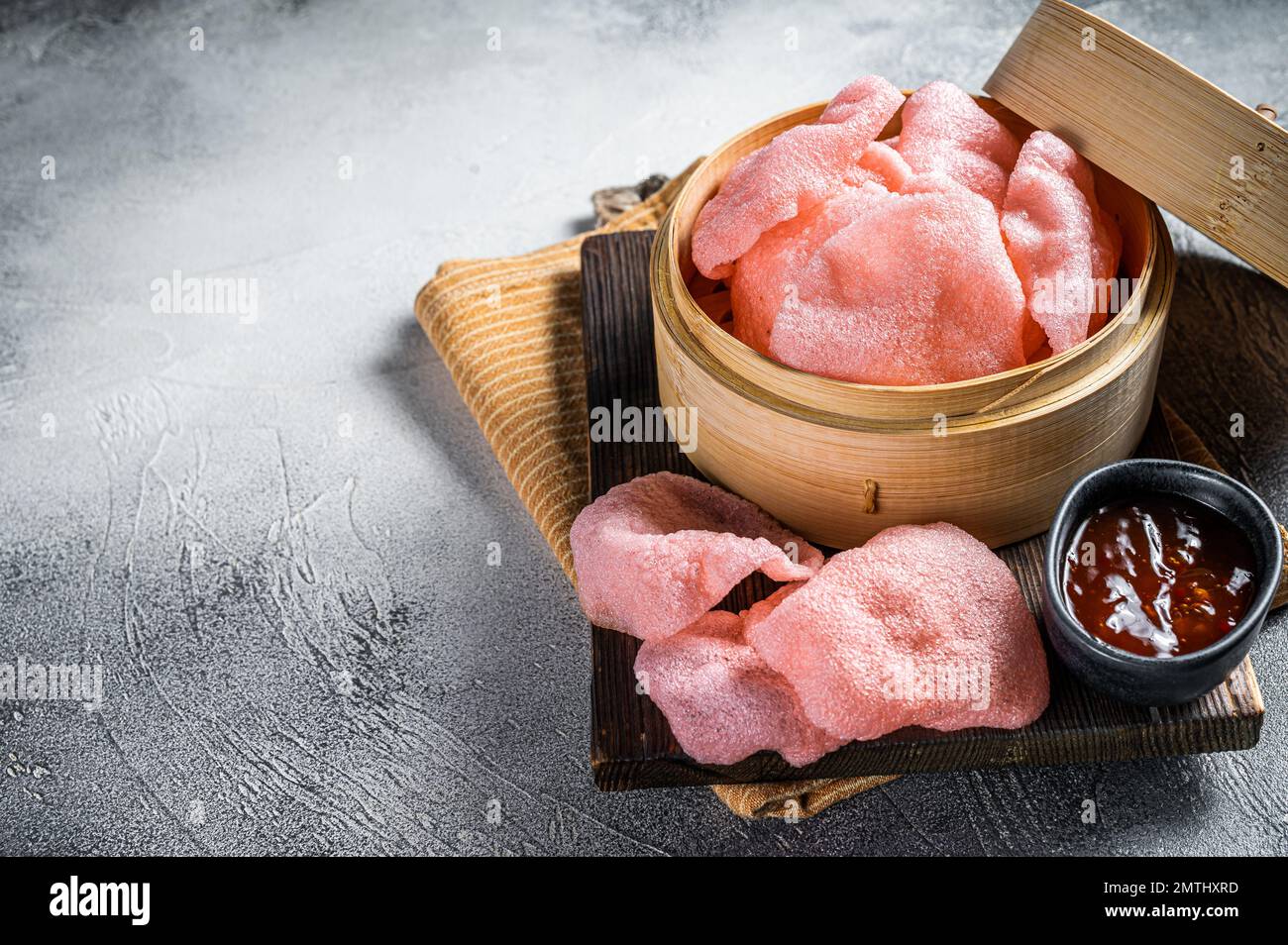 Indonesian prawn shrimp crackers or chips with sauce. White background ...