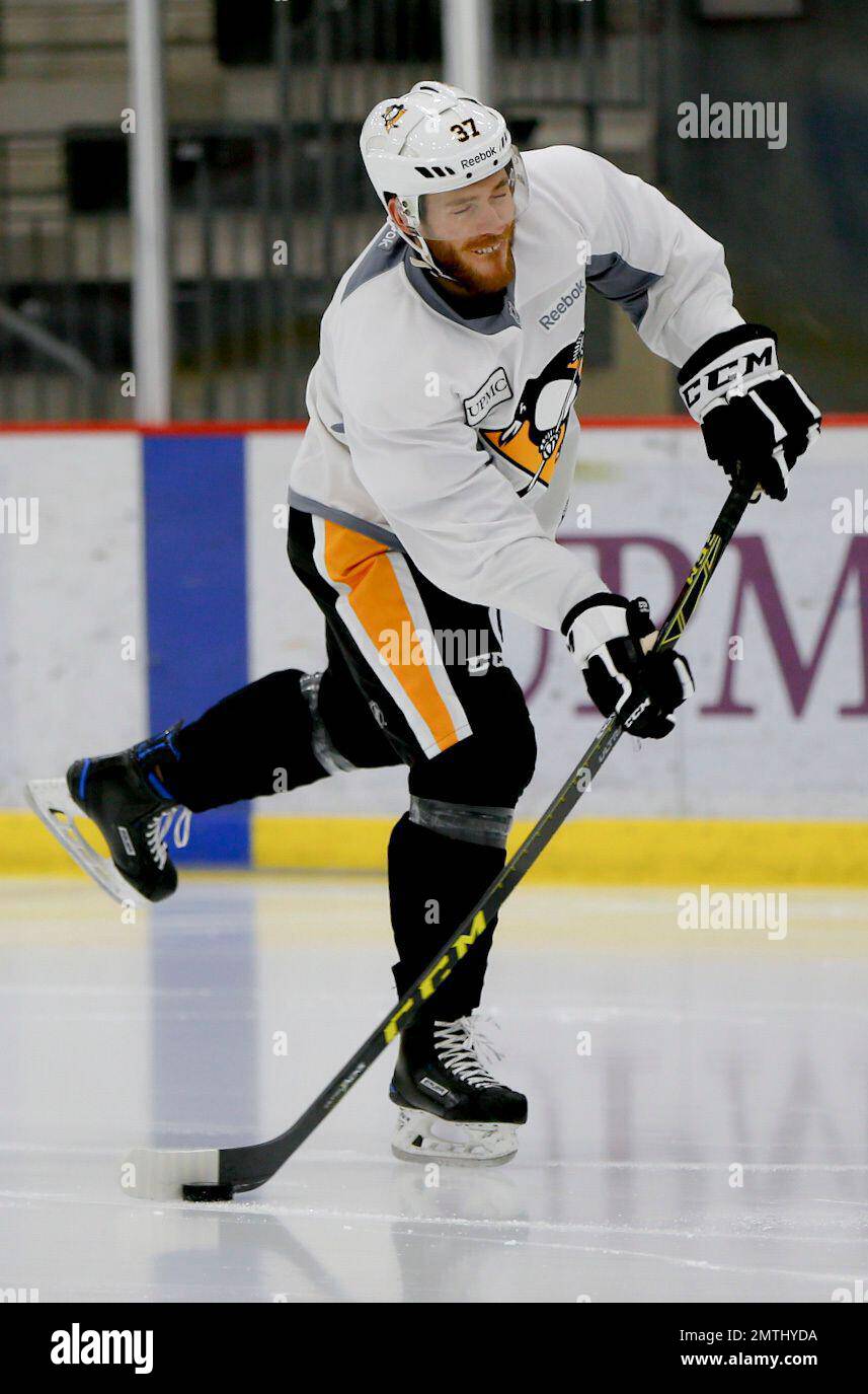 Pittsburgh Penguins' Carter Rowney (37) skates during hockey practice ...