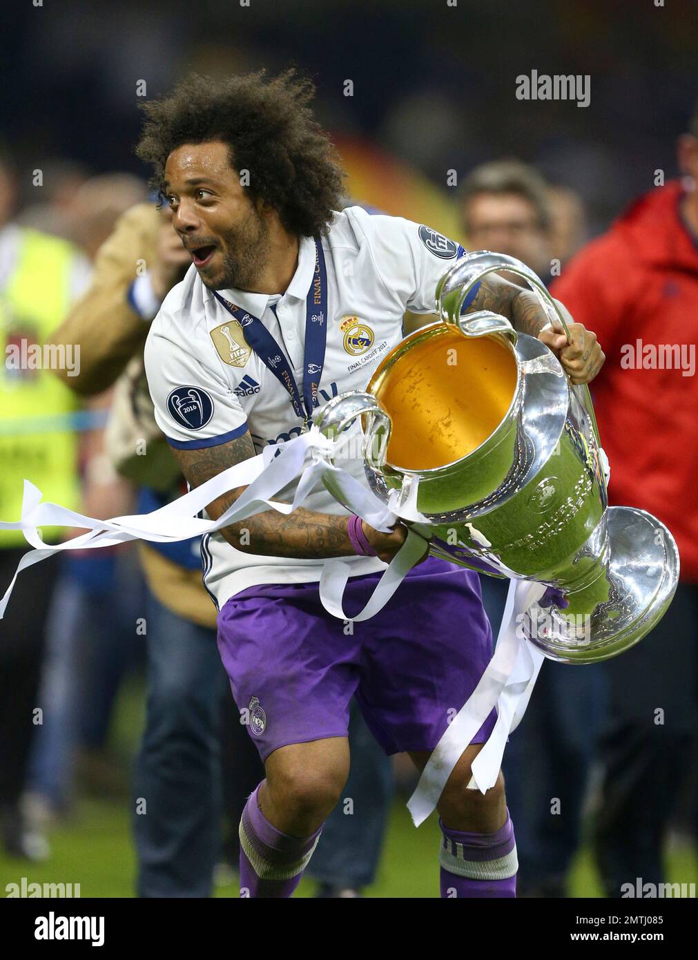 Real Madrid's Marcelo celebrates with the trophy after the Champions ...