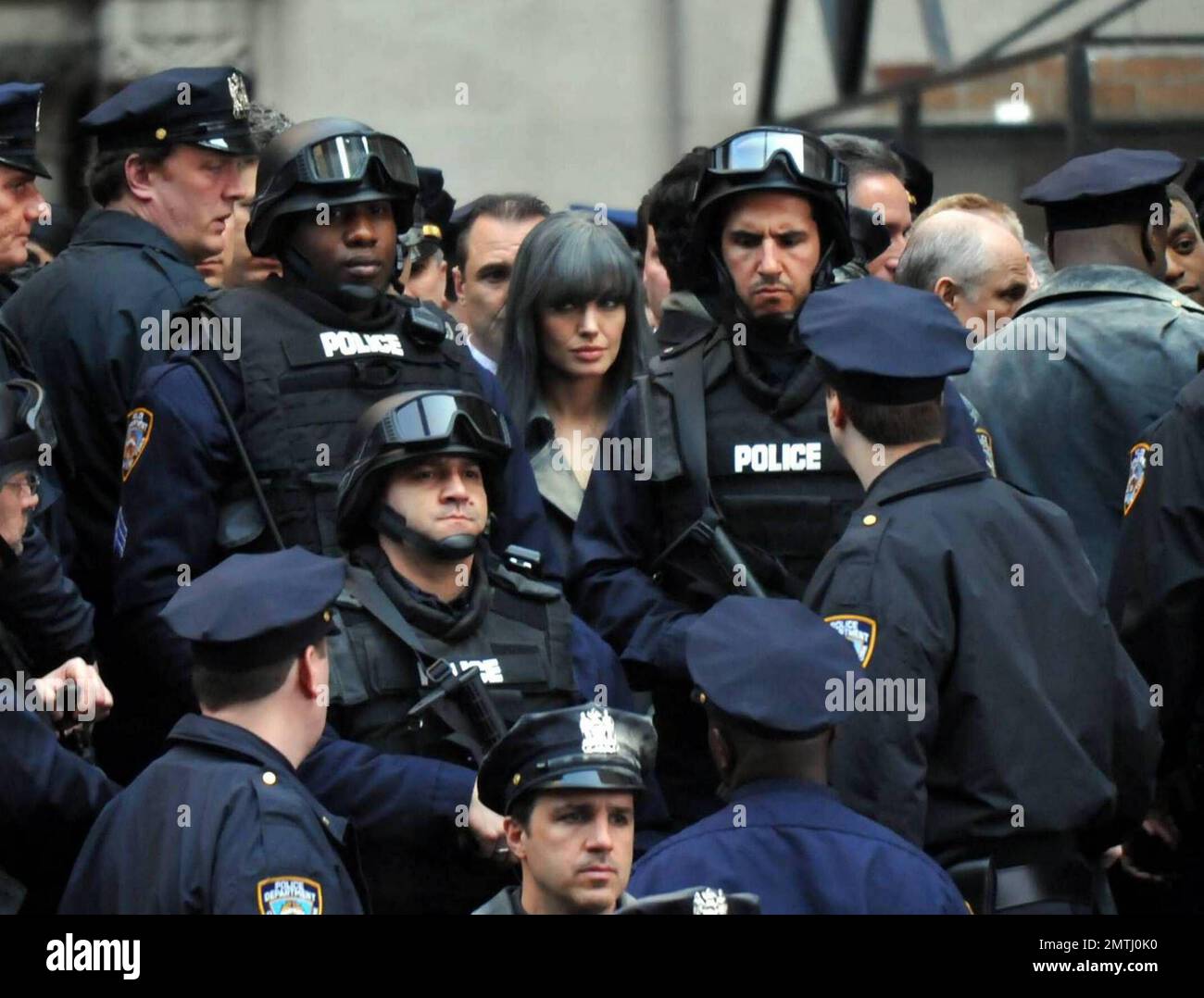 Actress Angelina Jolie and actor Liev Schreiber film a scene on the set ...