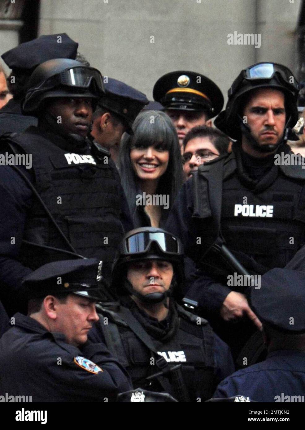 Actress Angelina Jolie and actor Liev Schreiber film a scene on the set ...