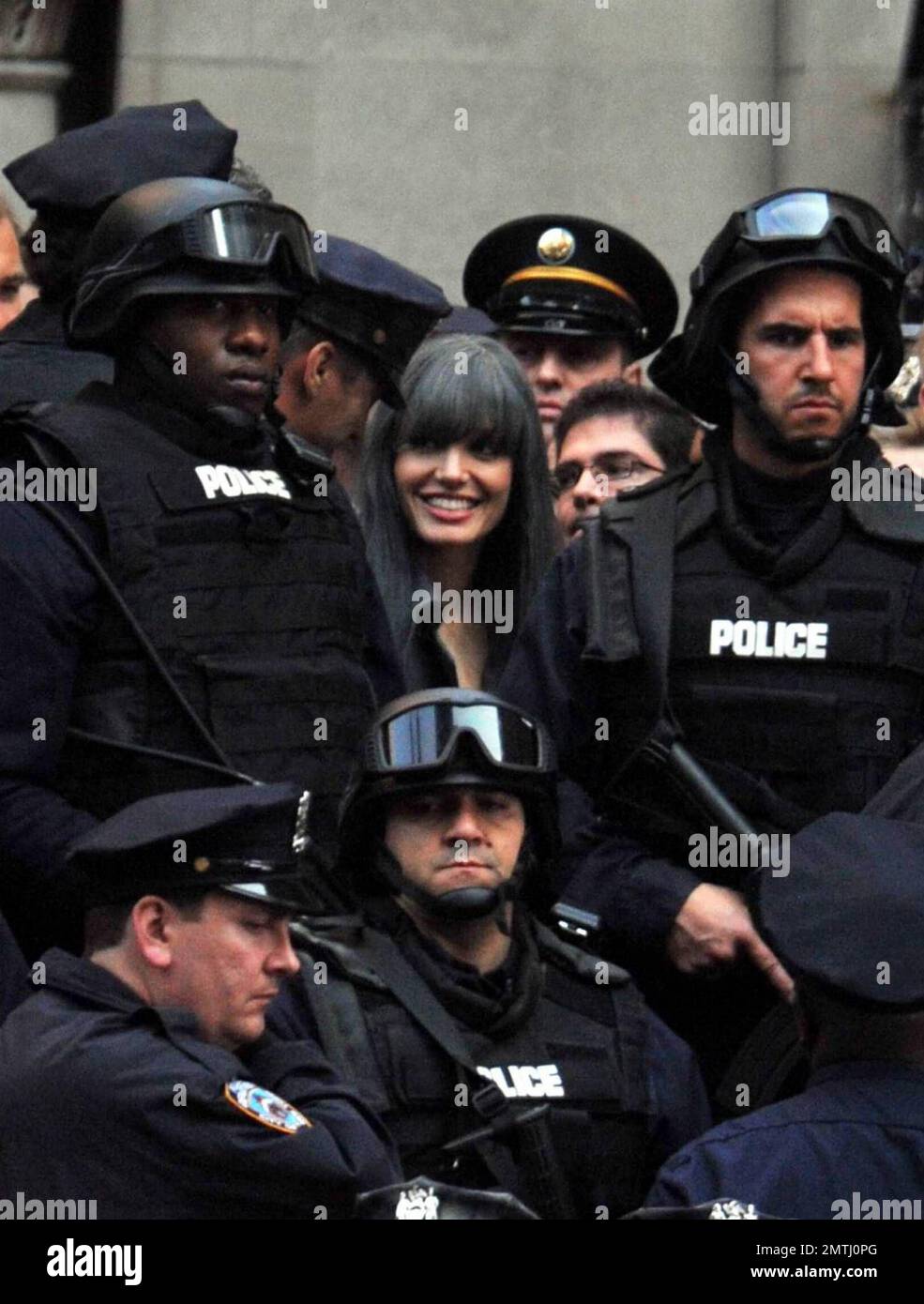 Actress Angelina Jolie and actor Liev Schreiber film a scene on the set ...