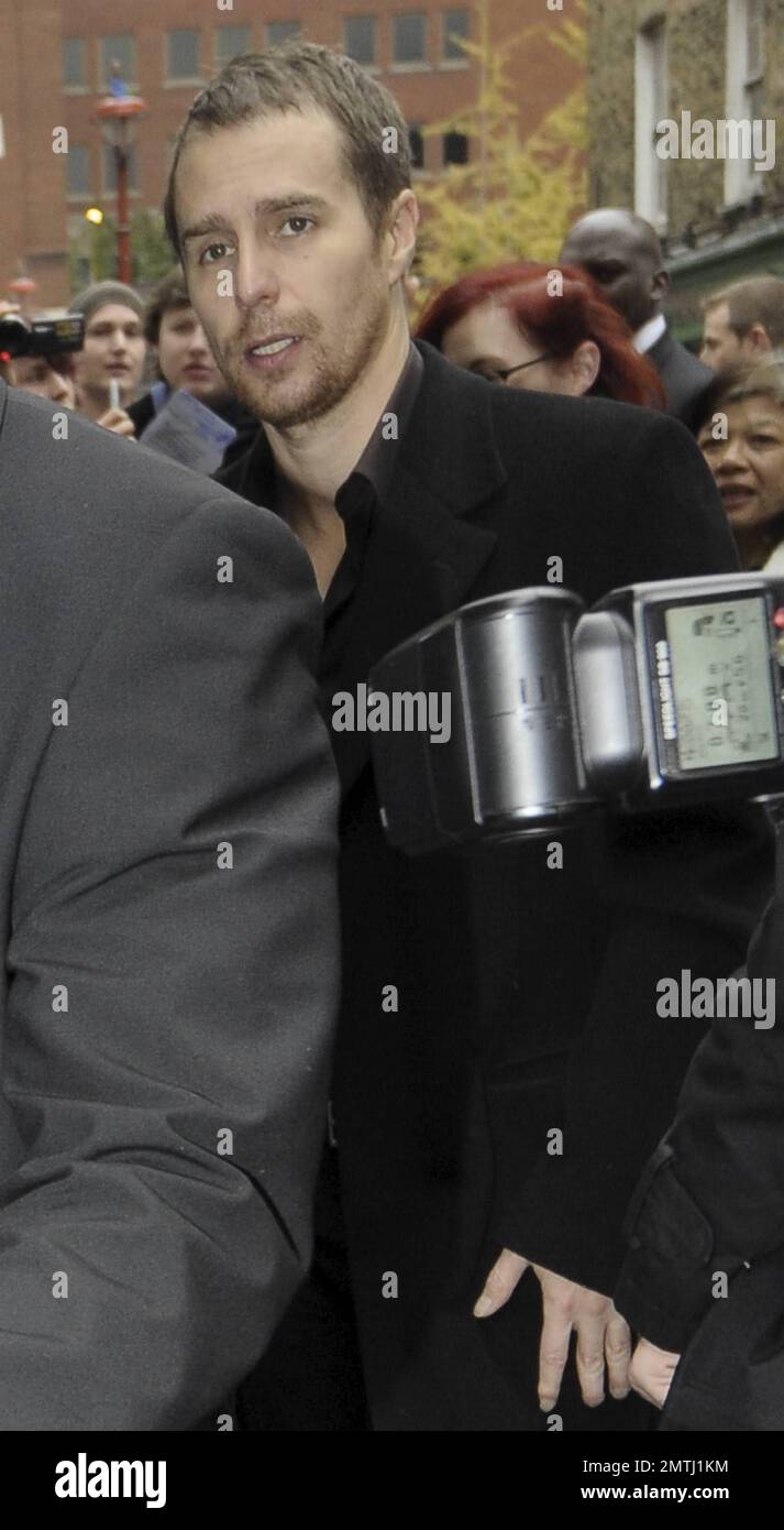 Protected by bodyguards, Sam Rockwell is surrounded by a huge crowd of ...