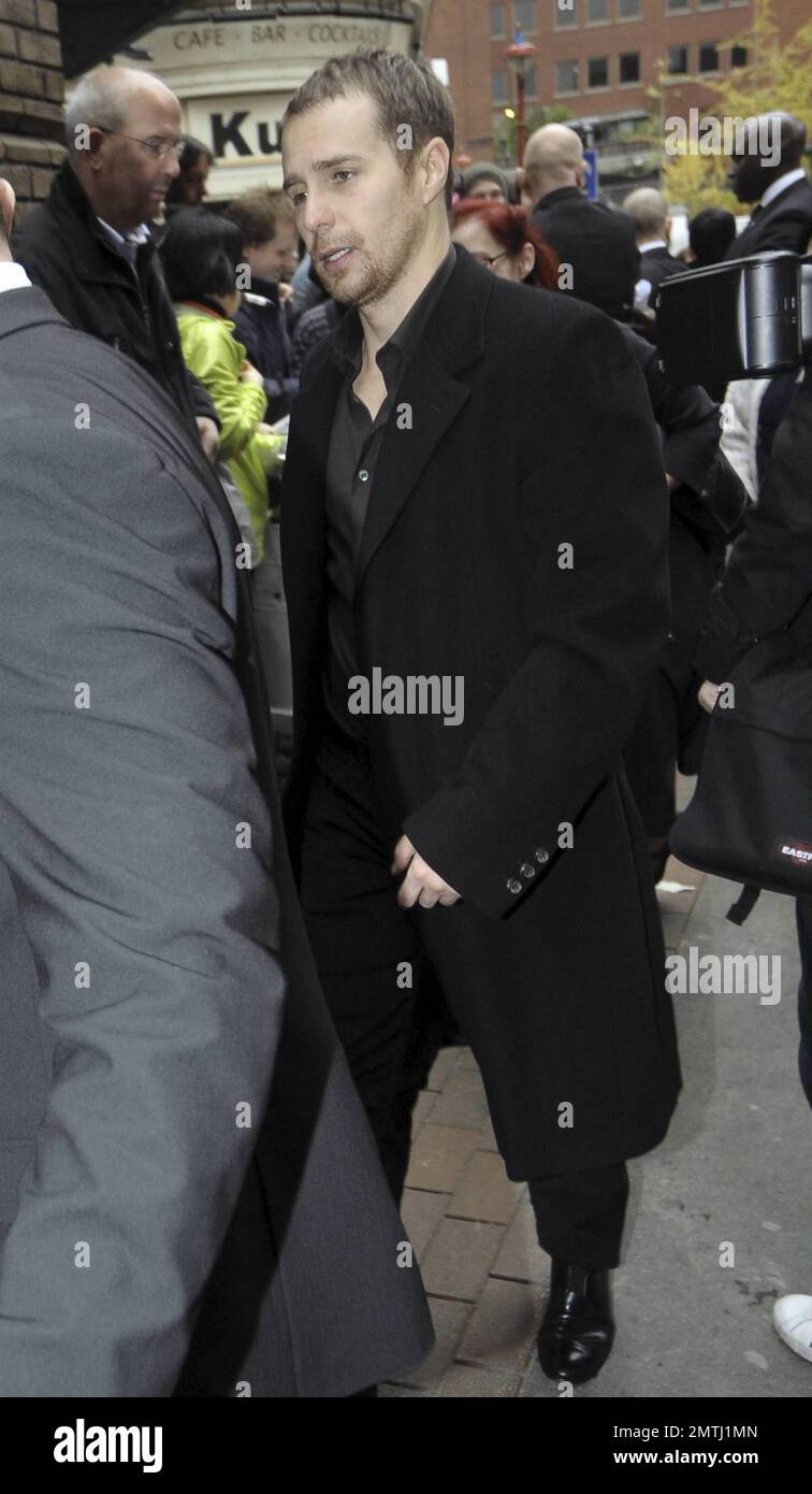 Protected by bodyguards, Sam Rockwell is surrounded by a huge crowd of ...