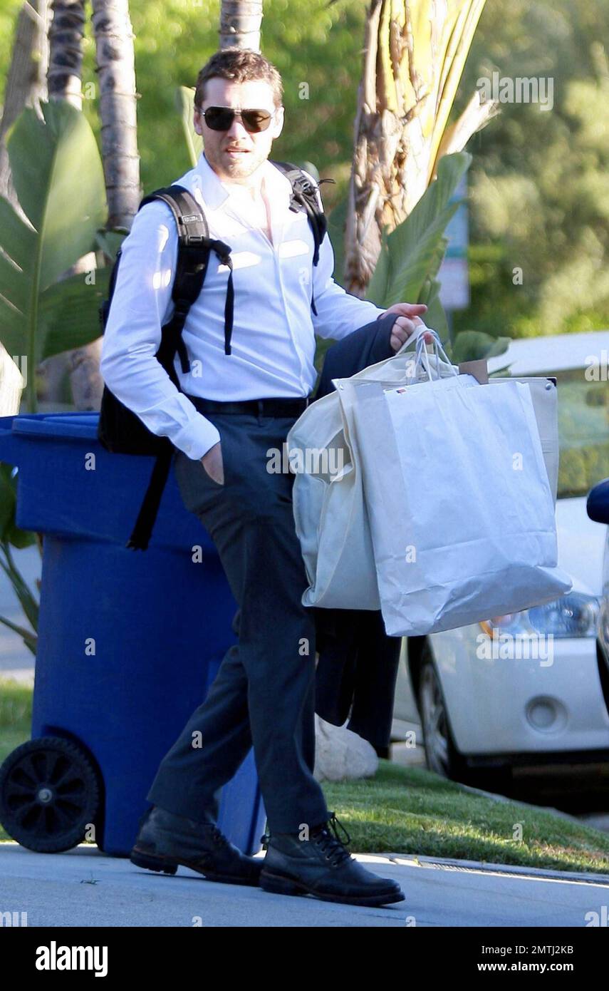 EXCLUSIVE!! A smartly dressed Sam Worthington leaves his home with bags ...