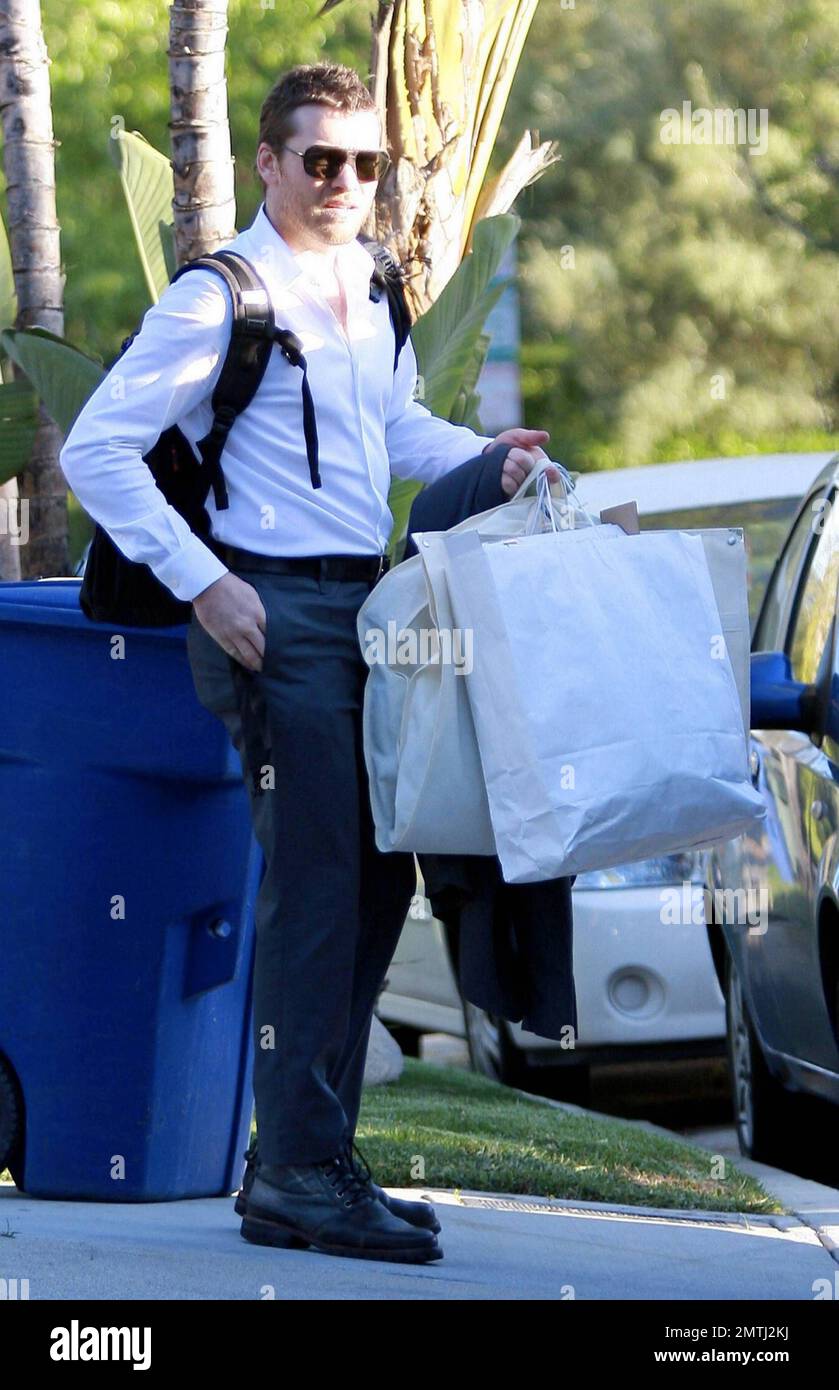 EXCLUSIVE!! A smartly dressed Sam Worthington leaves his home with bags ...