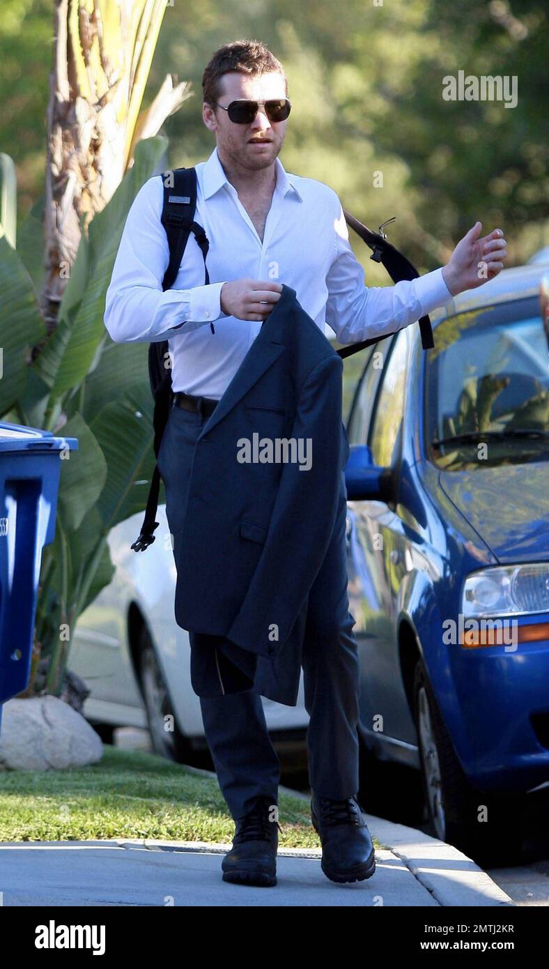 EXCLUSIVE!! A smartly dressed Sam Worthington leaves his home with bags ...