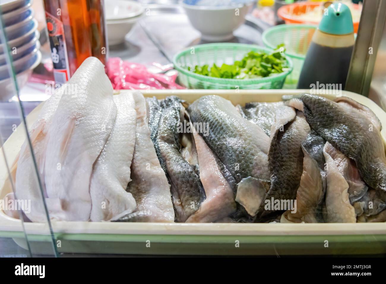 Close up shot of raw Milkfish slice in the traditional Nanjichang Night ...