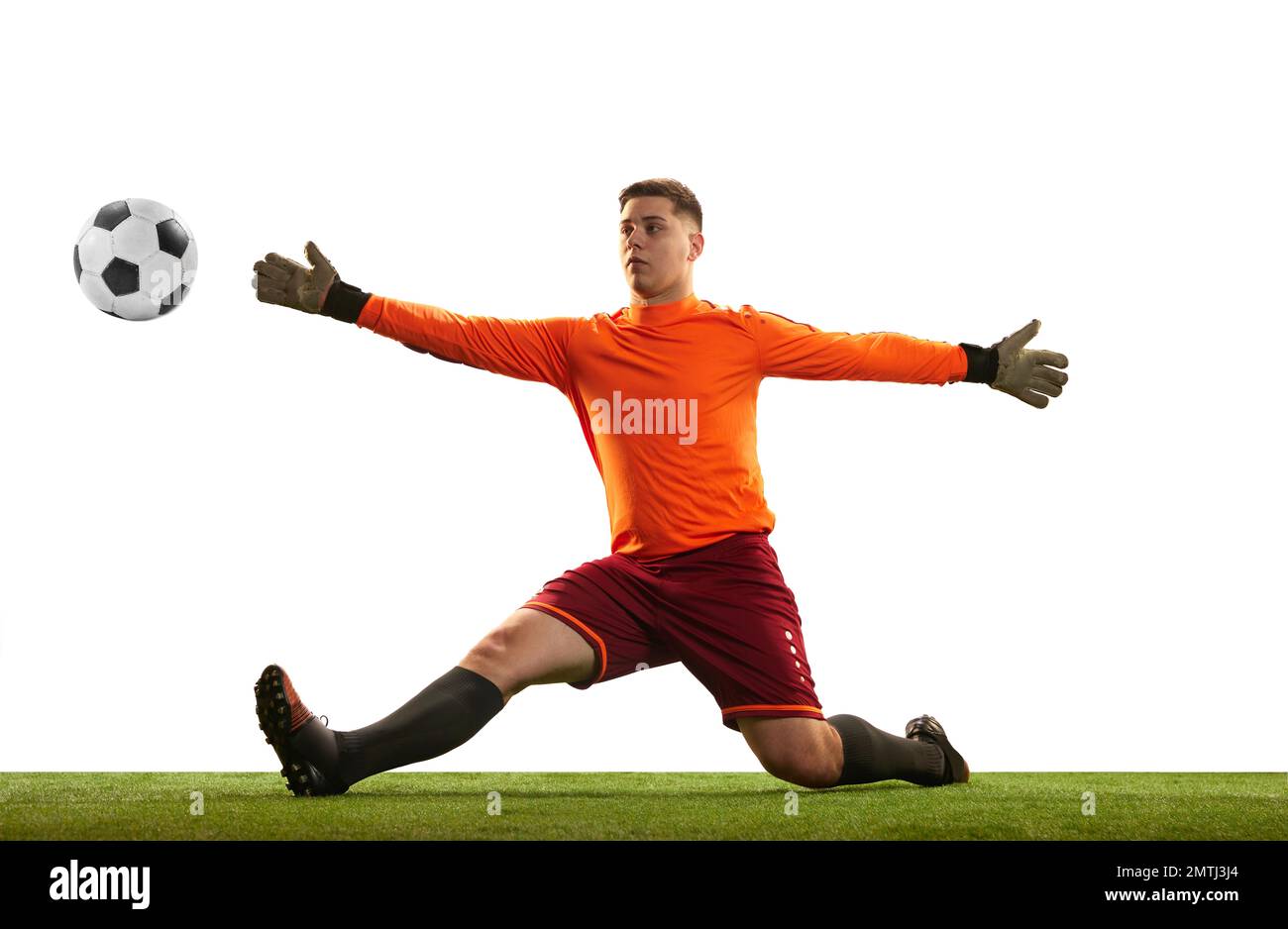 Professional soccer football goalkeeper in action, motion isolated over ...