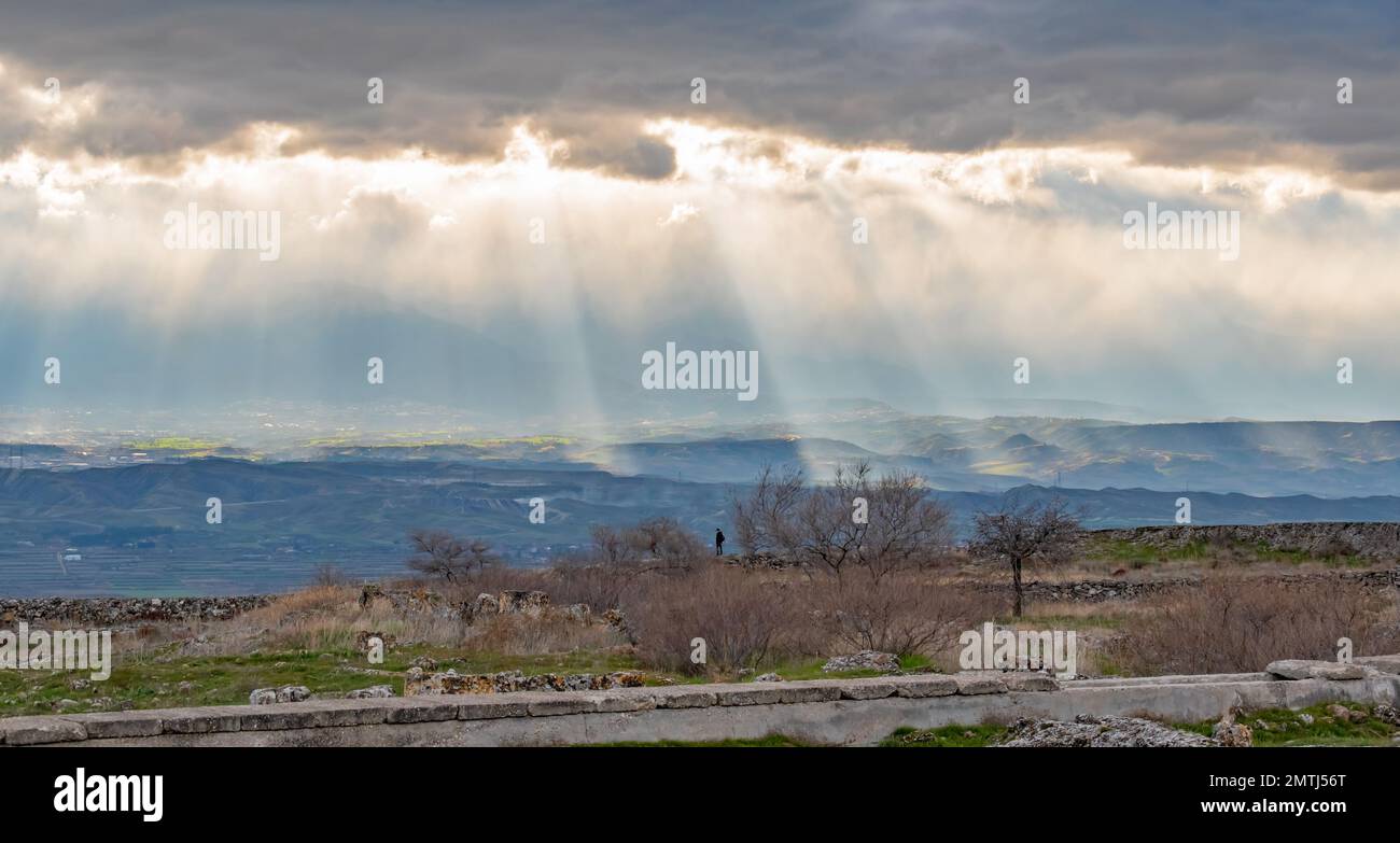 Groups of sunburst rays burst through the Turkey dark clouds lighting ...