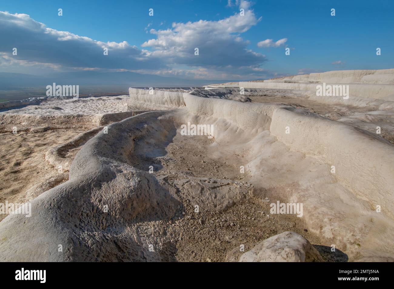 The strange twisting shaped white rocky calcium deposits at Pamukkale ...