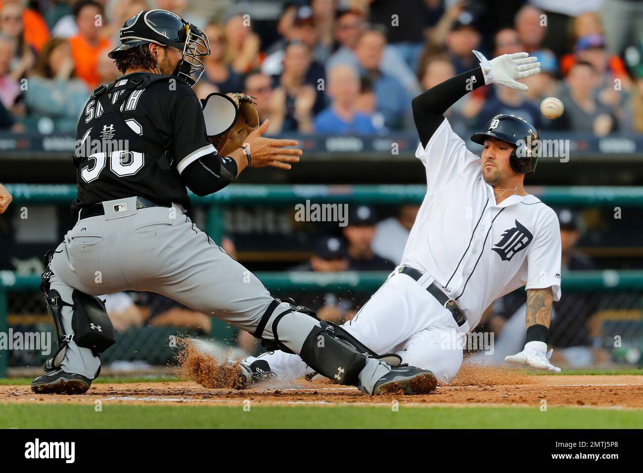 Detroit Tigers third baseman Nicholas Castellanos slides safely into ...