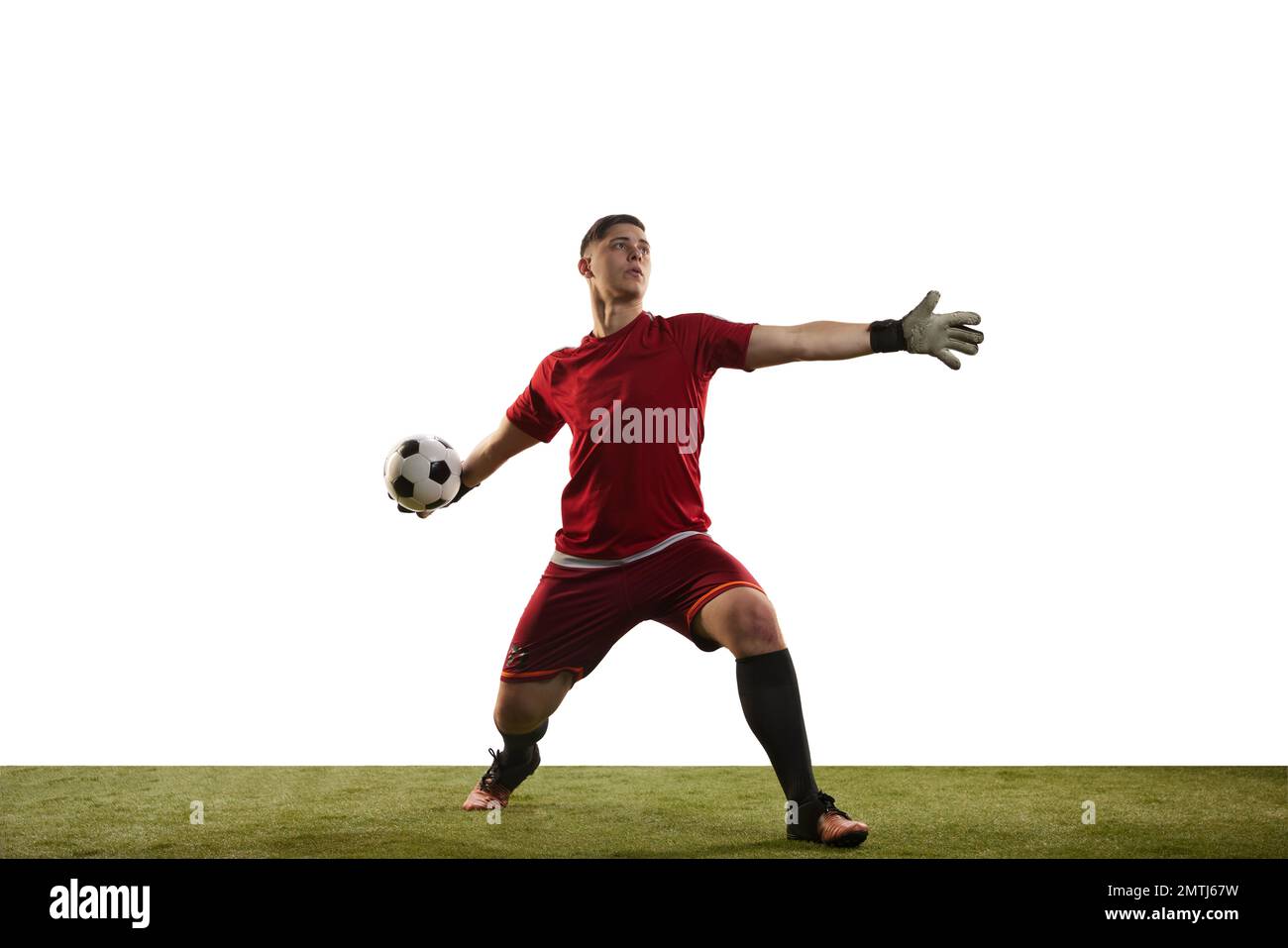 Young caucasian football player, male soccer goalkeeper wearing red ...