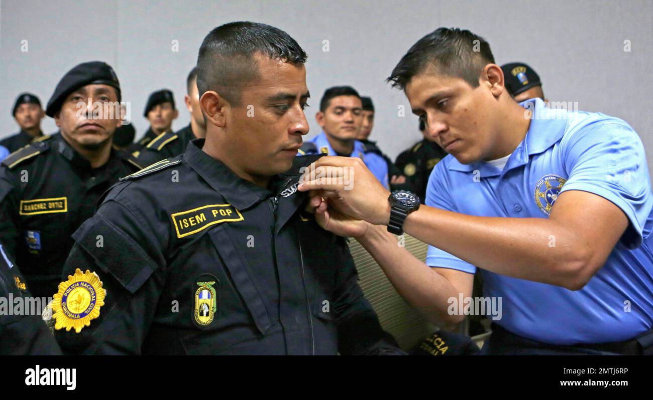 Graduate Evin Osmani Molina Cruz, of Honduras, right, pins the SWAT ...