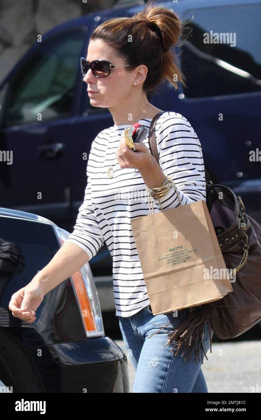 Exclusive Sandra Bullock Aleaves Matty European Skin Care Eating What Appears To Be Chocolates