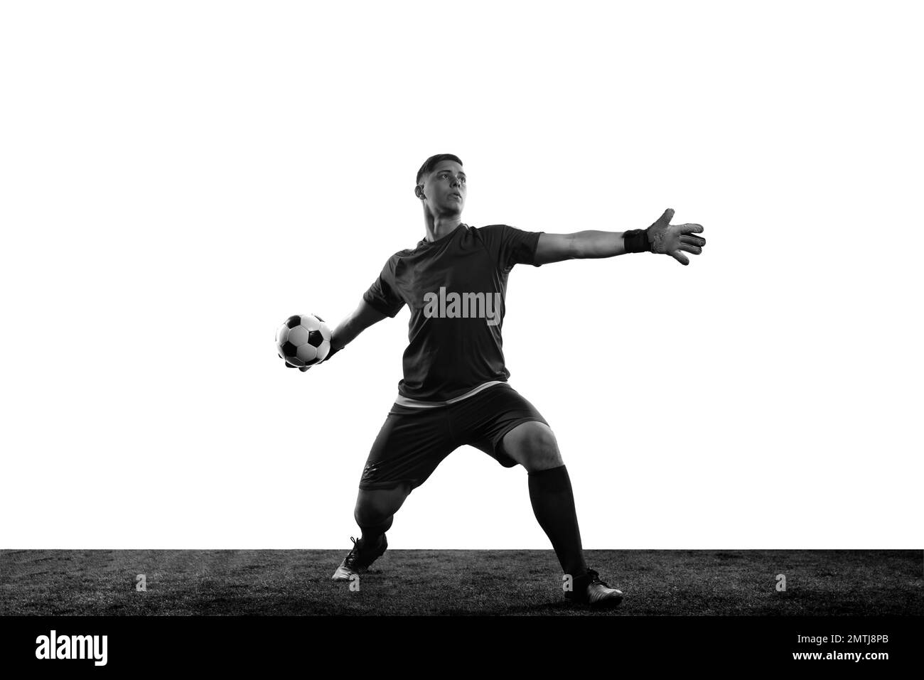 Black and white portrait of male soccer football goalkeeper psoing ...