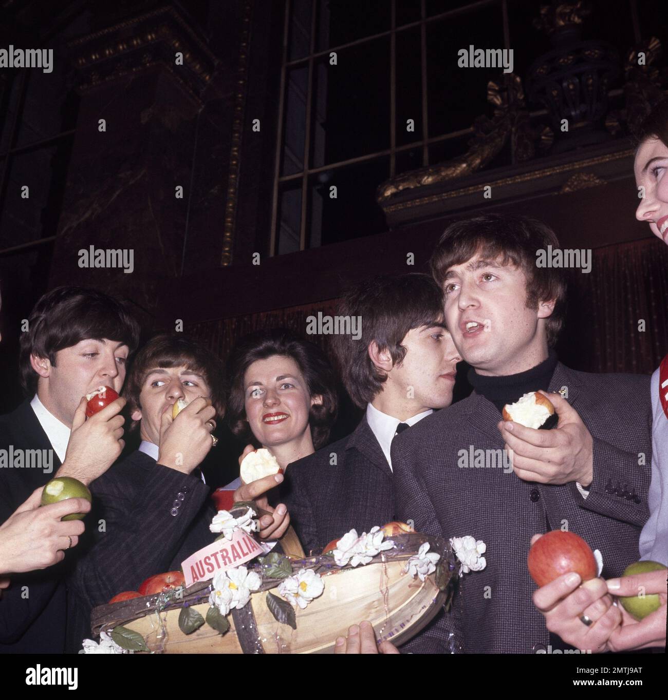 The Beatles eat apples during a reception at Australia House in London ...