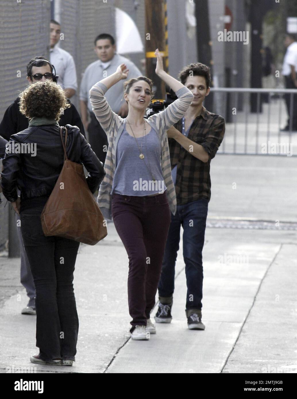 Singer Sara Bareilles waves and cheers back at her cheering fans after ...