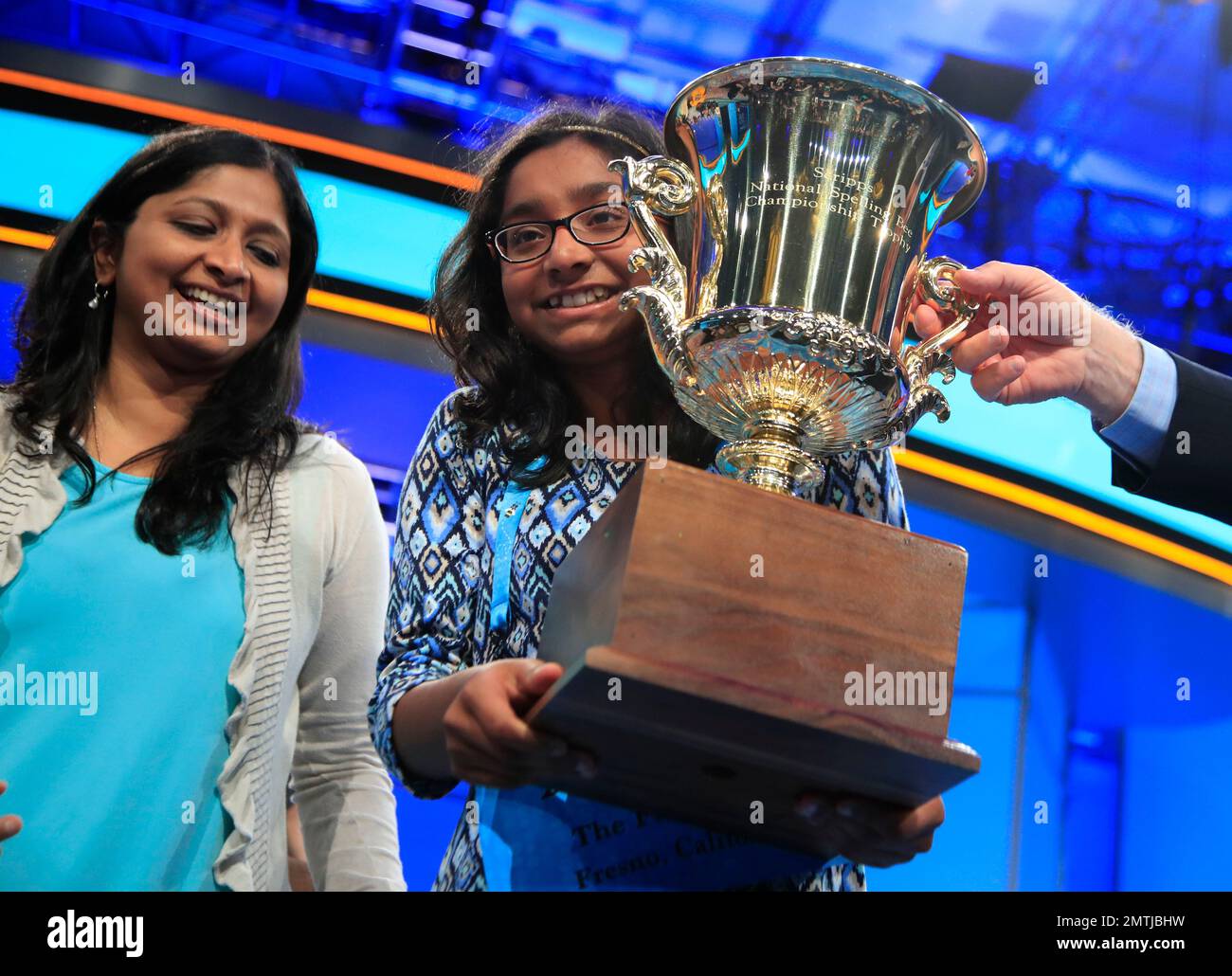 Ananya Vinay, 12, from Fresno, Calif., with her mother, holds her ...