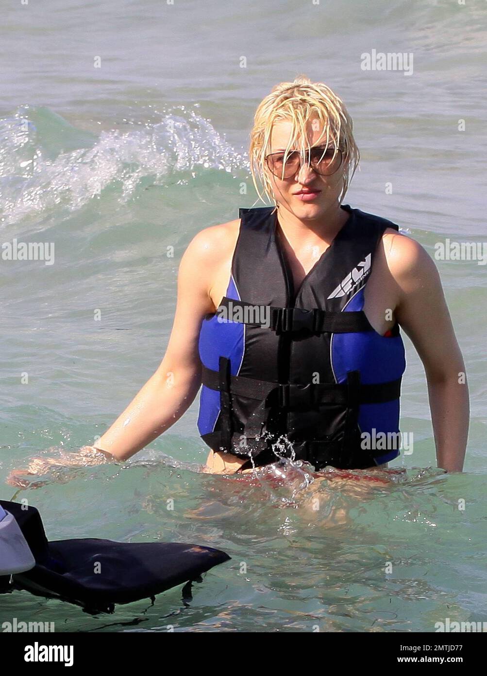 Russian singer Sasha Gradiva shows off her shapely body in a red bikini ...
