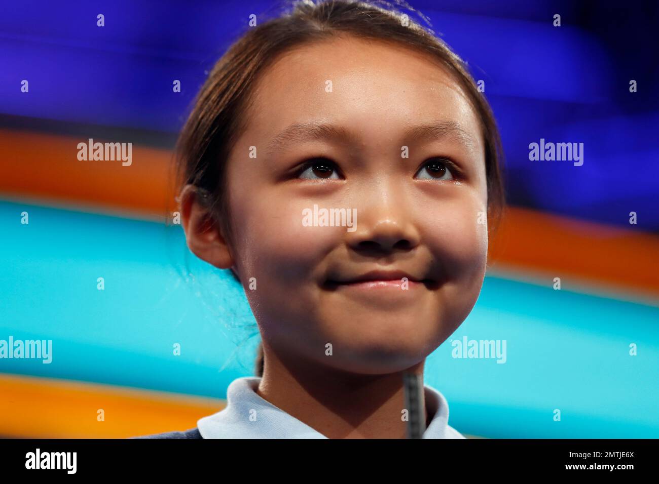Alice Liu, 10, from Chesterfield, Mo., smiles before spelling her word ...