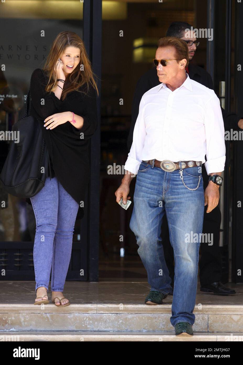 Wearing a western-styled outfit complete with green crocodile cowboy ...