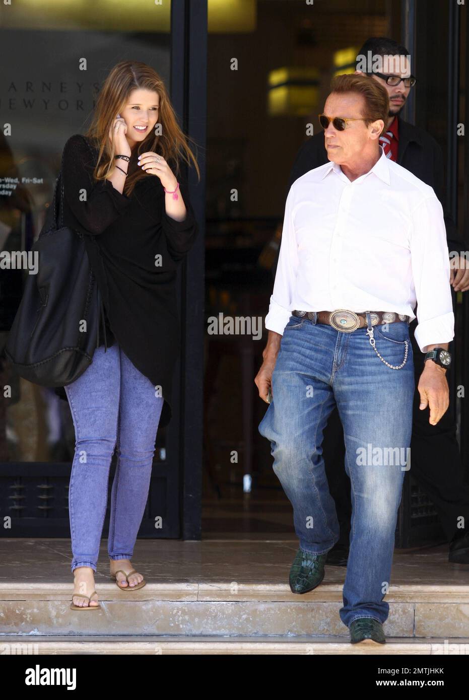 Wearing a western-styled outfit complete with green crocodile cowboy ...