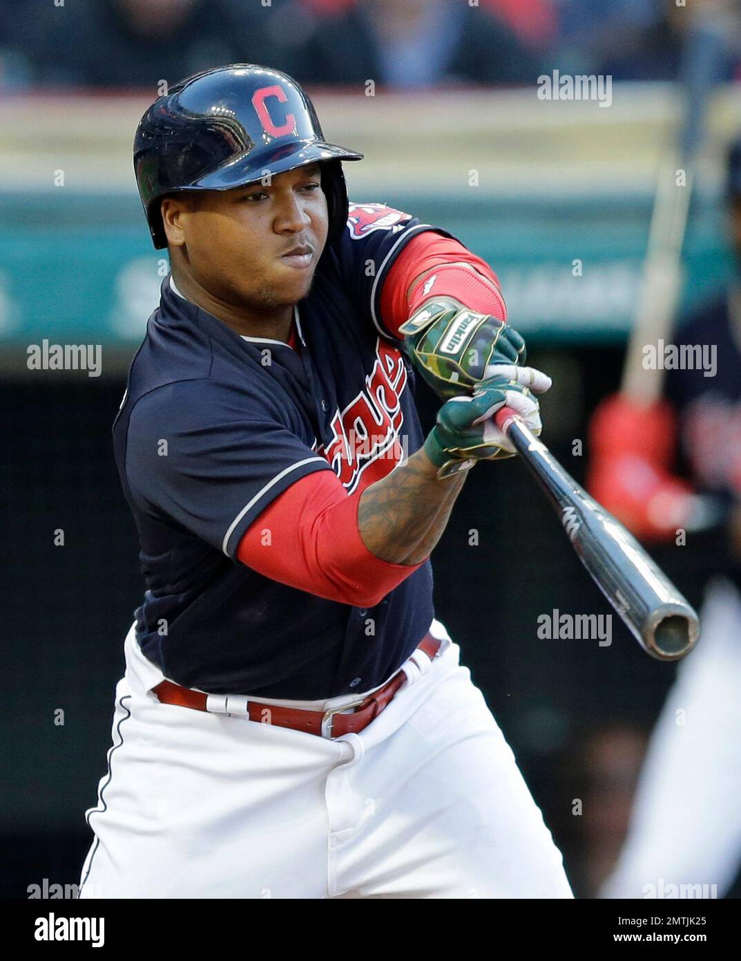 Cleveland Indians' Jose Ramirez swings for strike three in the seventh ...