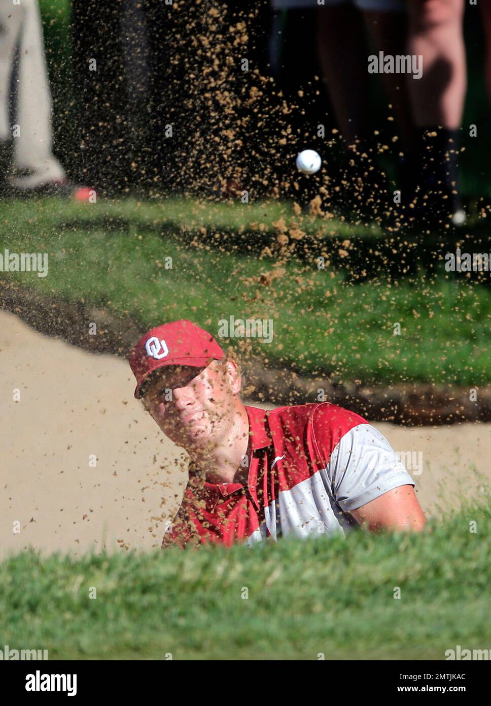Oklahoma's Brad Dalke hits out of the bunker on the 9th green during ...