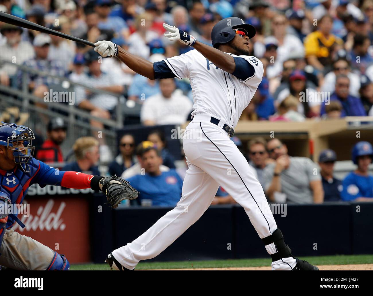 San Diego Padres' Franchy Cordero, right, hits a triple with Chicago ...