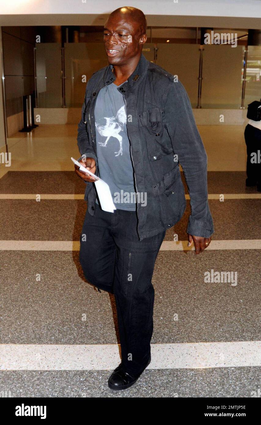 London-born musician Seal arrives at LAX from London, smiling as he ...