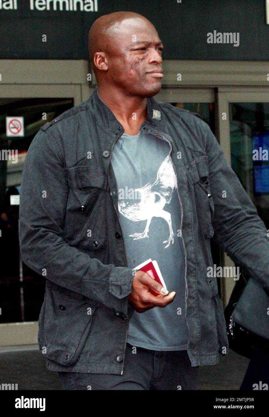London-born musician Seal arrives at LAX from London, smiling as he ...