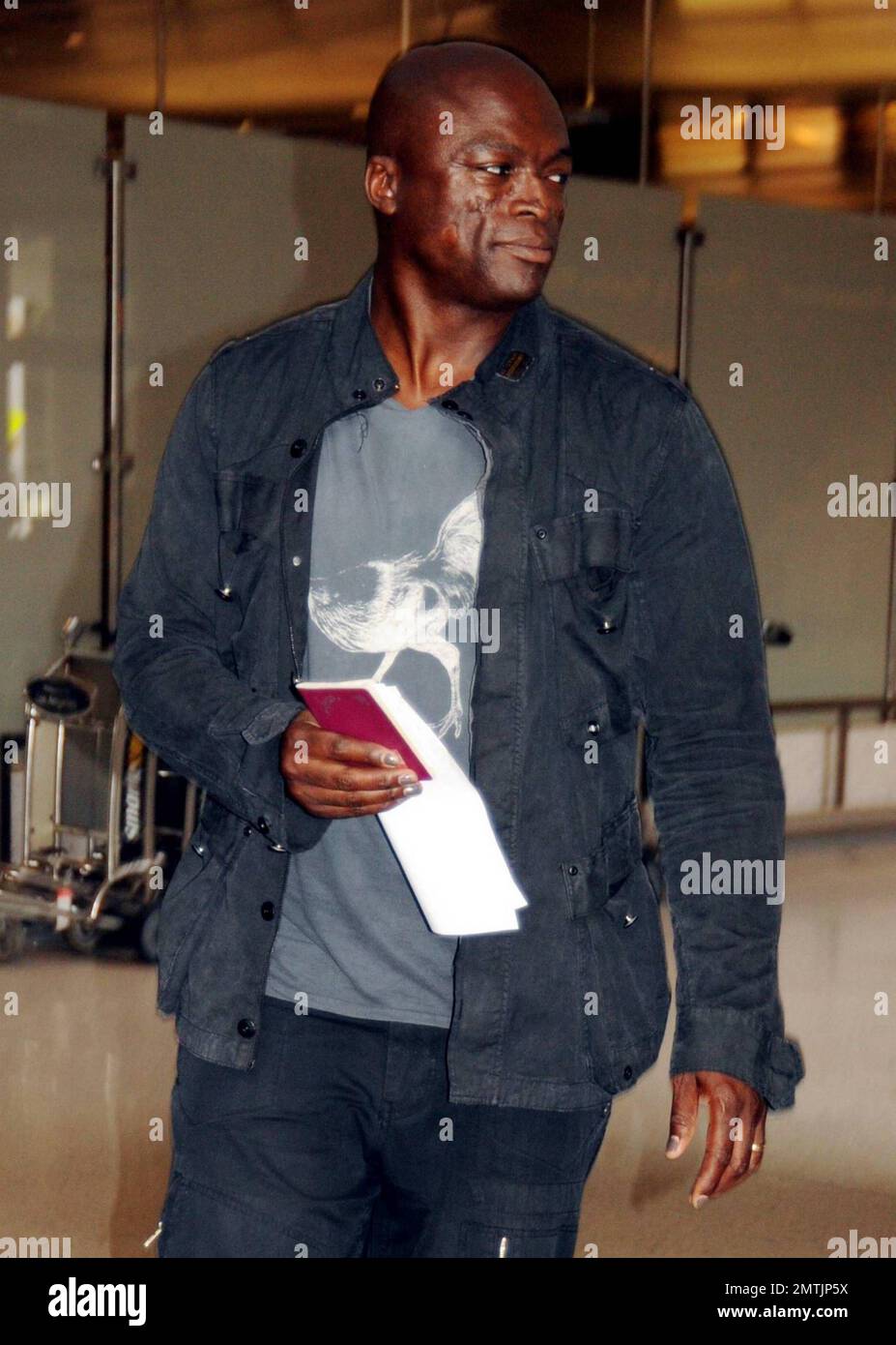 London-born musician Seal arrives at LAX from London, smiling as he ...