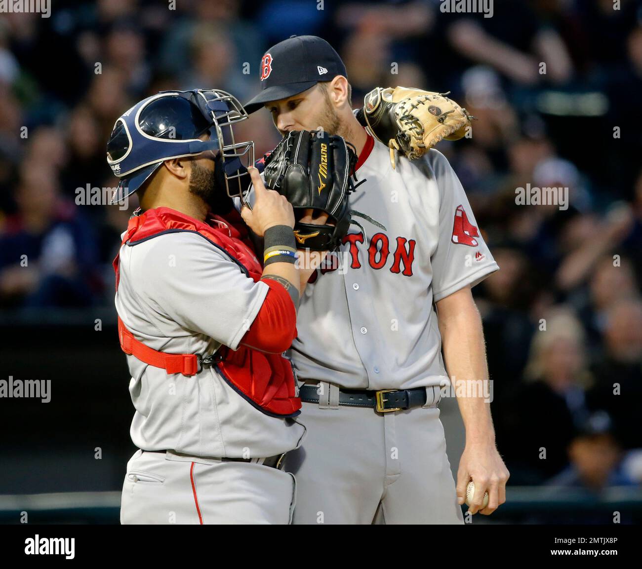 Boston Red Sox catcher Sandy Leon, left, talks with starting pitcher ...