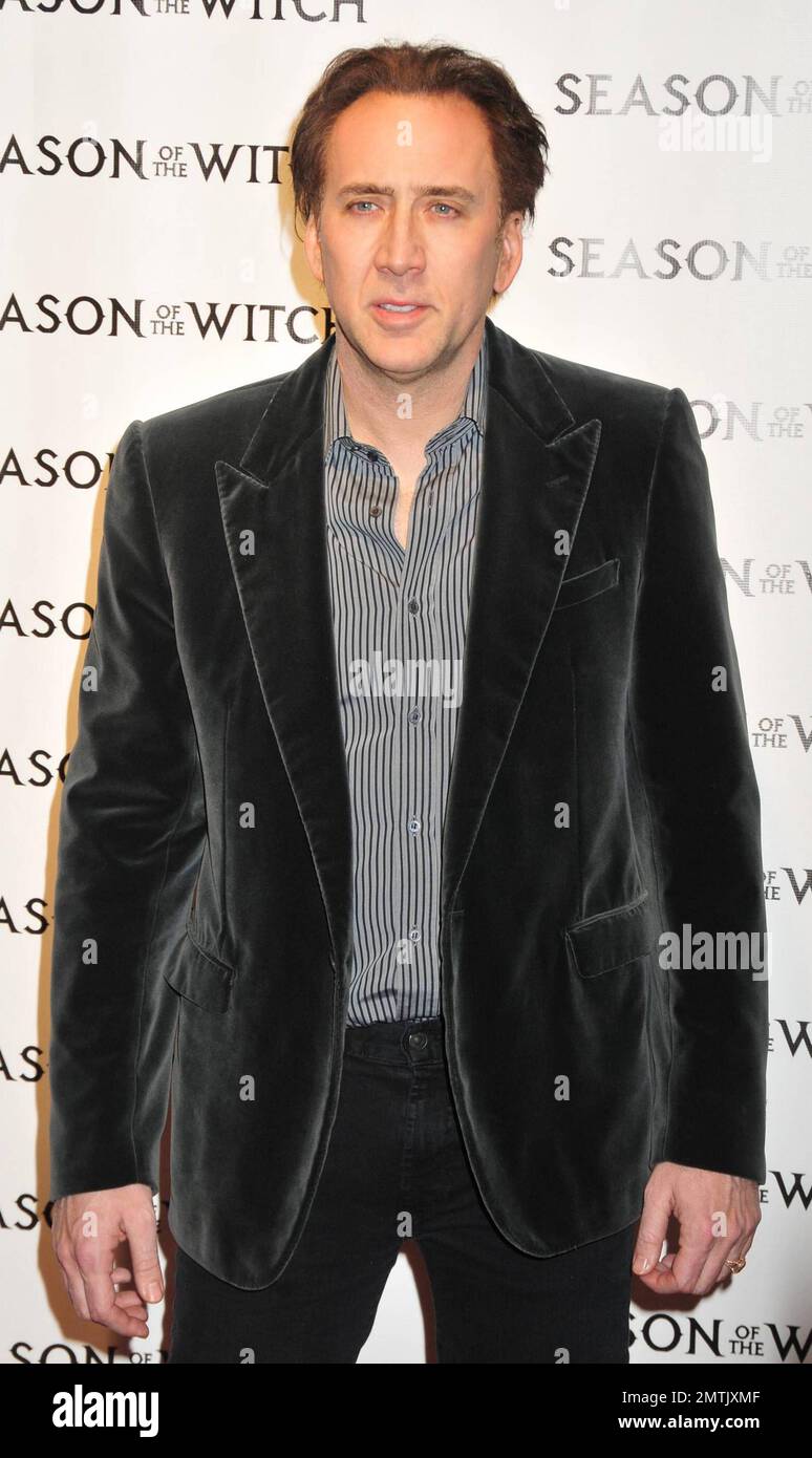 In a velvet jacket Nicolas Cage poses for photographers and speaks with ...