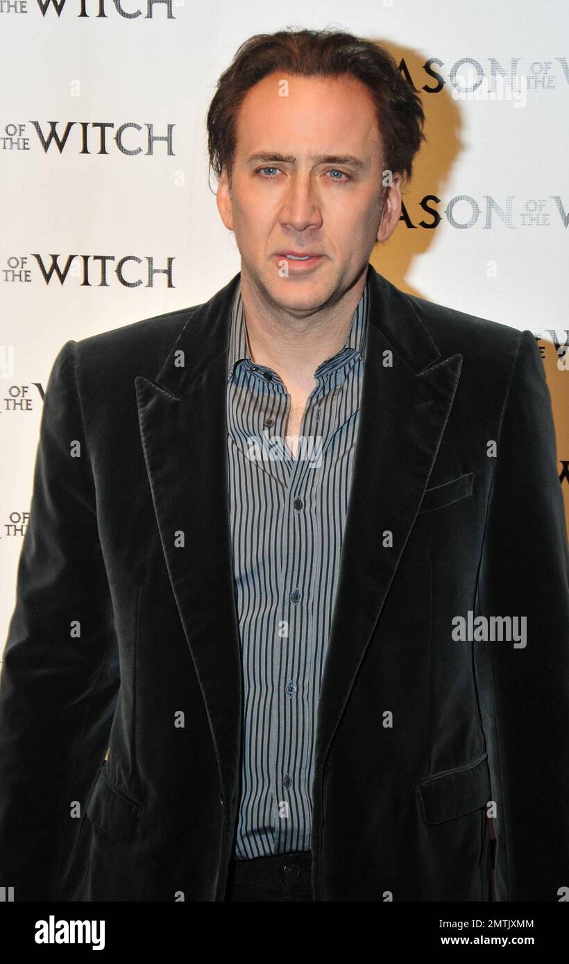In a velvet jacket Nicolas Cage poses for photographers and speaks with ...