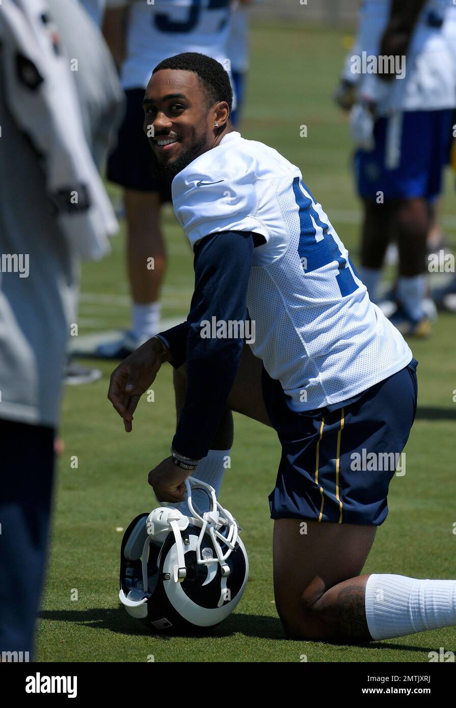 Los Angeles Rams defensive back John Johnson III kneels on the field ...
