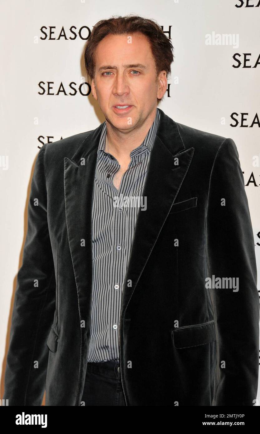 In a velvet jacket Nicolas Cage poses for photographers and speaks with ...