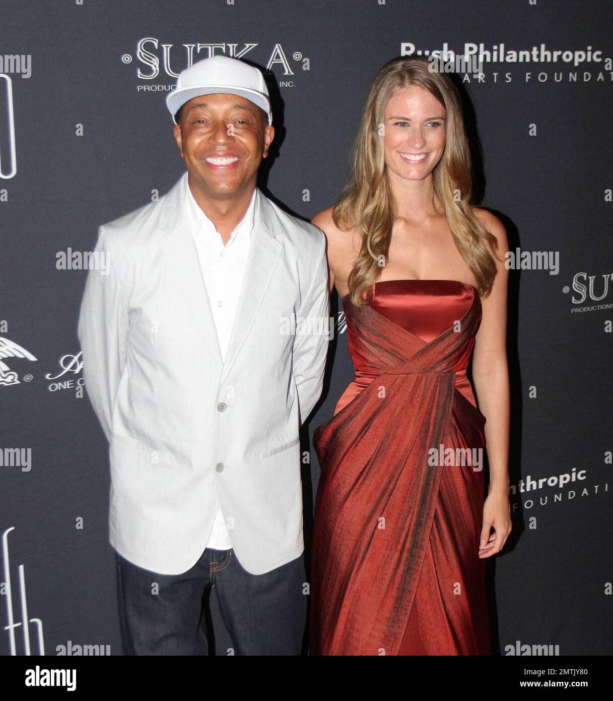Julie Henderson and Russell Simmons attend the Second Annual Art For ...