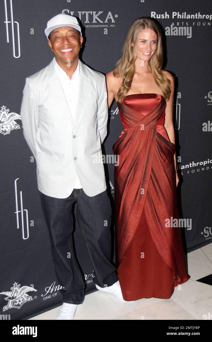 Julie Henderson and Russell Simmons attend the Second Annual Art For ...