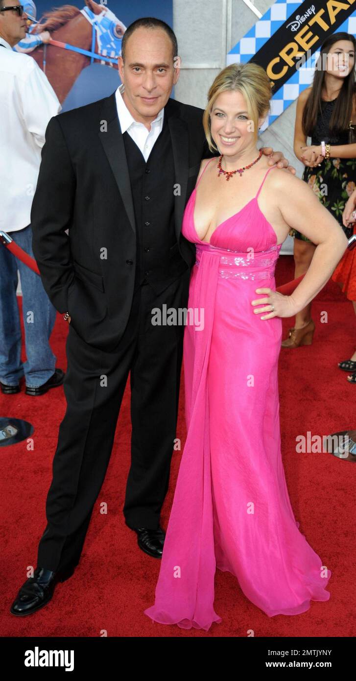 Nestor Serrano (L) and guest walk the red carpet at the world premiere of ÒSecretariatÓ held at ...