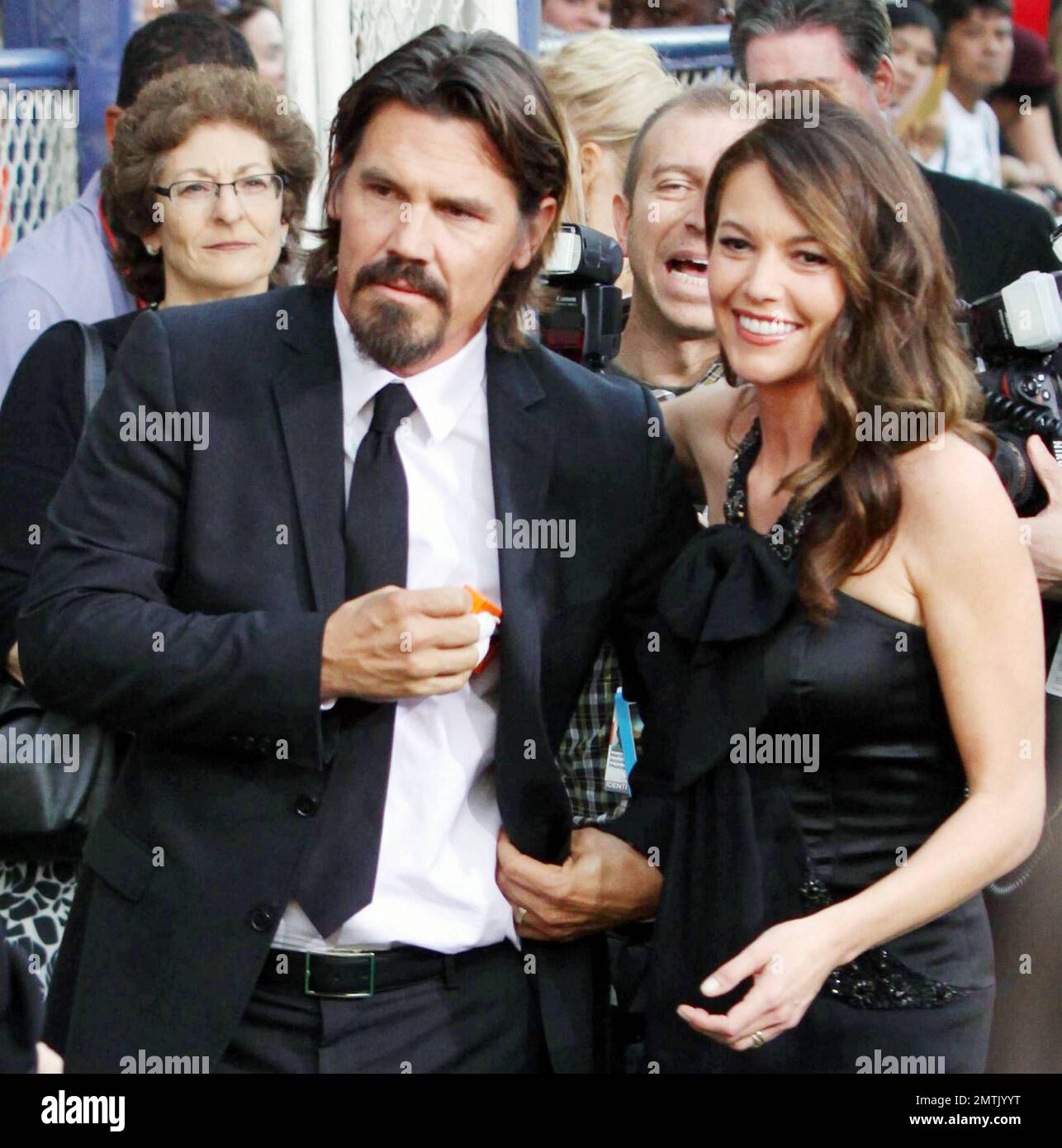 Diane Lane (R) and husband Josh Brolin, who appears to have a finger ...