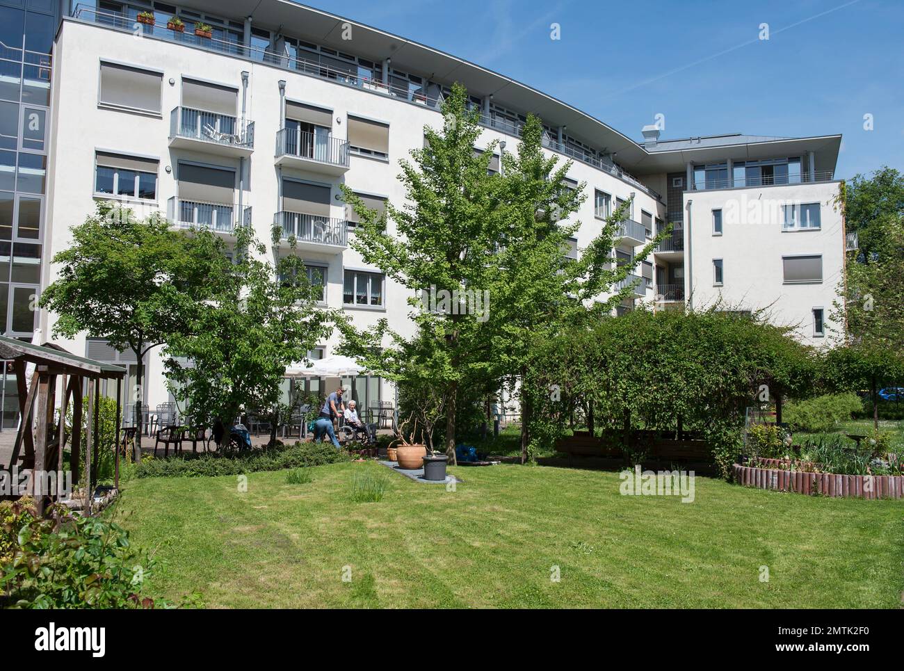 In this May 17, 2017 photo residents walk in the garden of the Alexa ...