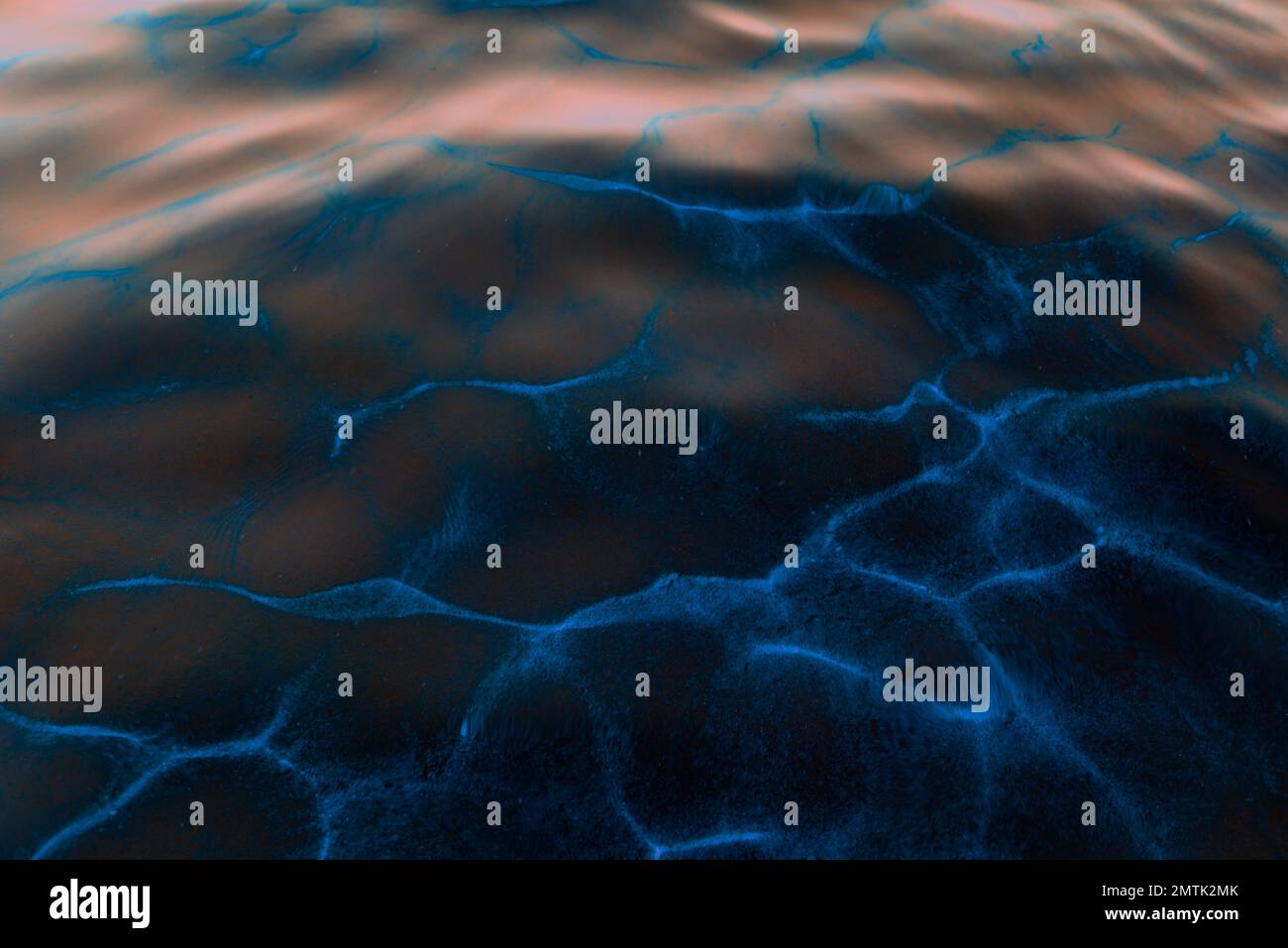 The background is natural. Abstract photo of a glowing water surface ...