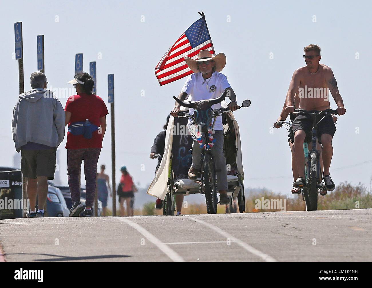 David Foute, 53, of Galveston, Texas, pedals along the beachfront bike ...