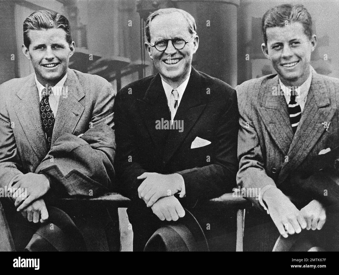 FILE - In this 1938 file photo, John F. Kennedy, right, poses aboard an ...