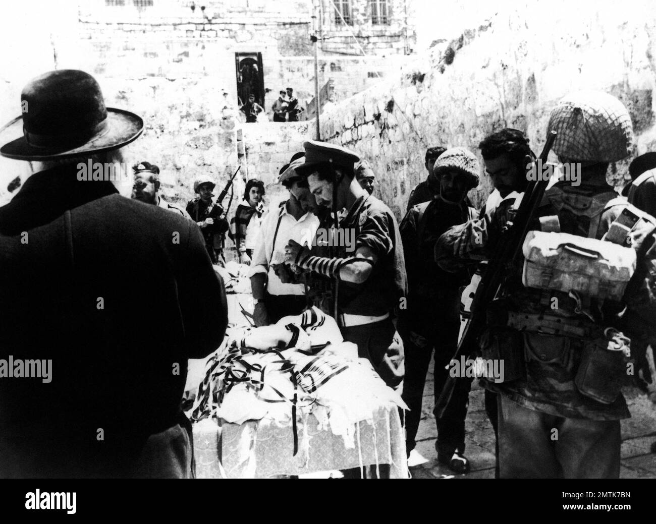 File - In this June 8, 1967 file photo an orthodox Jew lends prayer ...