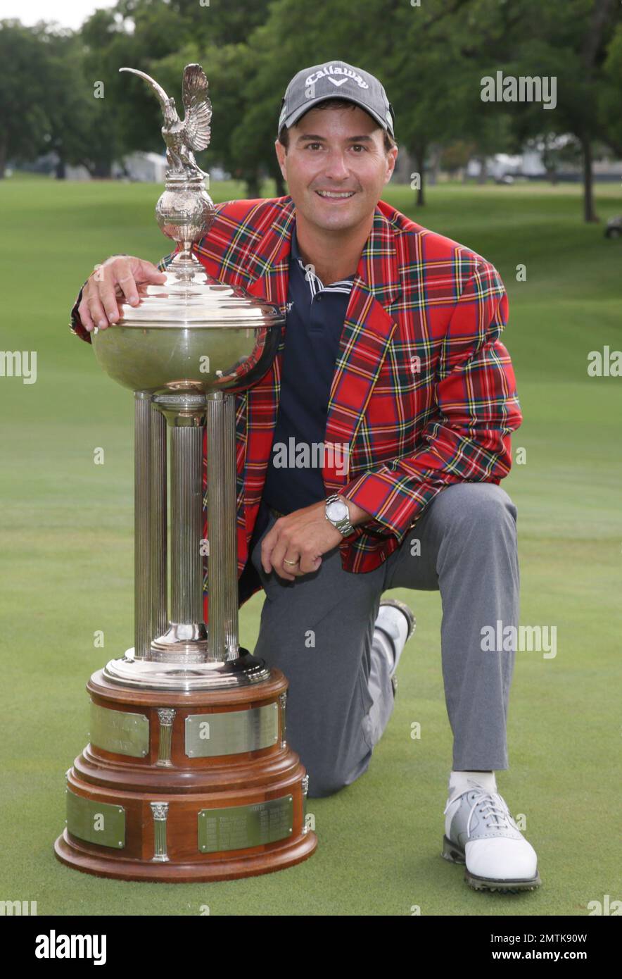 Kevin Kisner posses with the championship trophy after winning the Dean ...