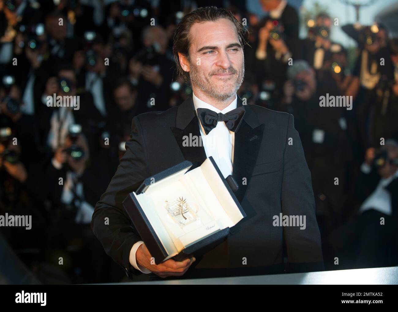 Actor Joaquin Phoenix with his Best Actor award for the film You Were ...