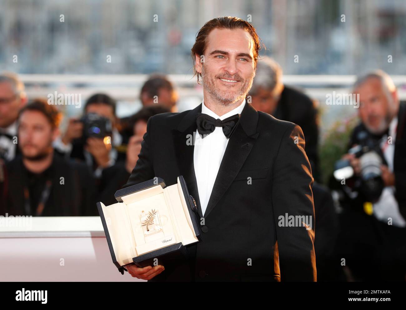 Actor Joaquin Phoenix with his Best Actor award for the film You Were ...